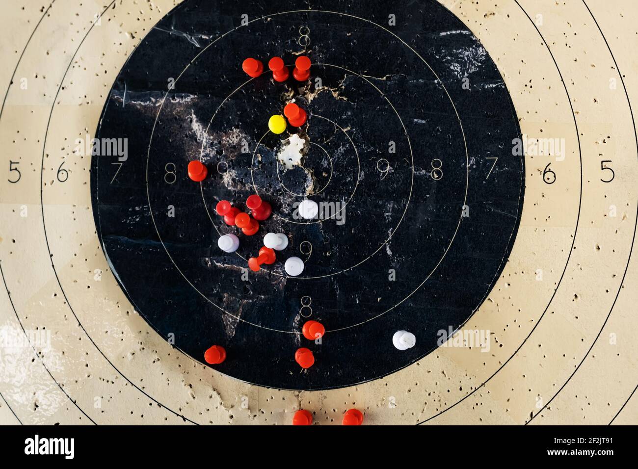 The target is marked with pins. Colored pins indicate on the target in ...