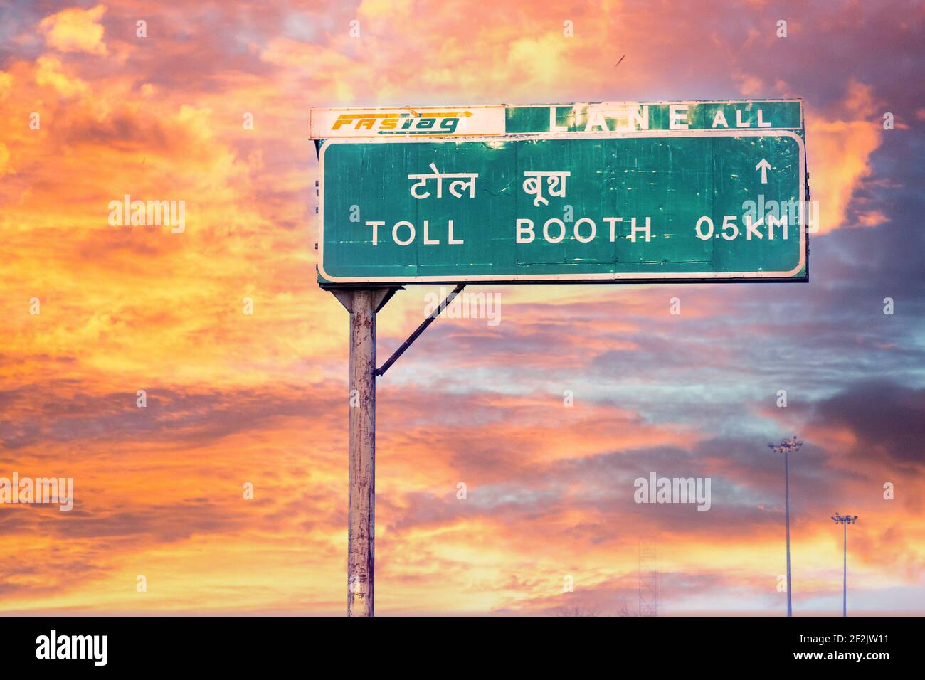 Toll booth sign near a toll booth showing the new cashless RFID based ...
