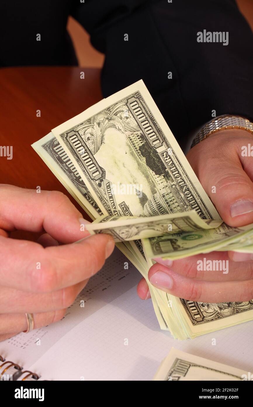 Man finds money, hands men hold dollars Stock Photo - Alamy