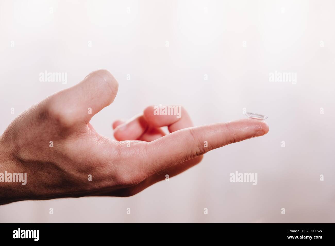 Hand holding lens hi-res stock photography and images - Alamy