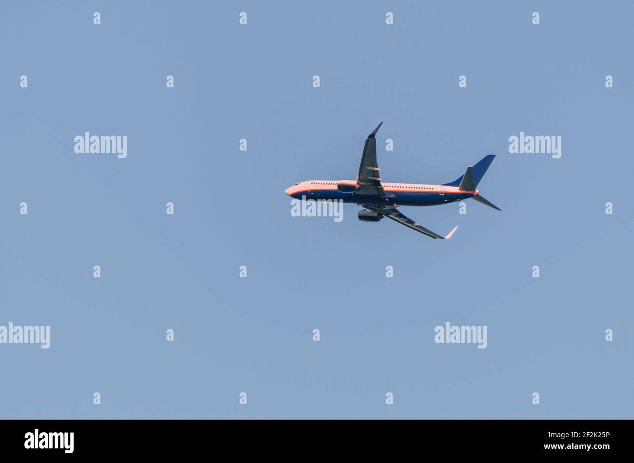 Airliner flying high in the sky Stock Photo - Alamy