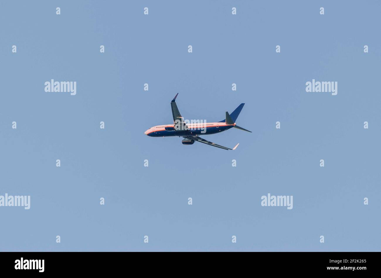 Airliner flying high in the sky Stock Photo - Alamy