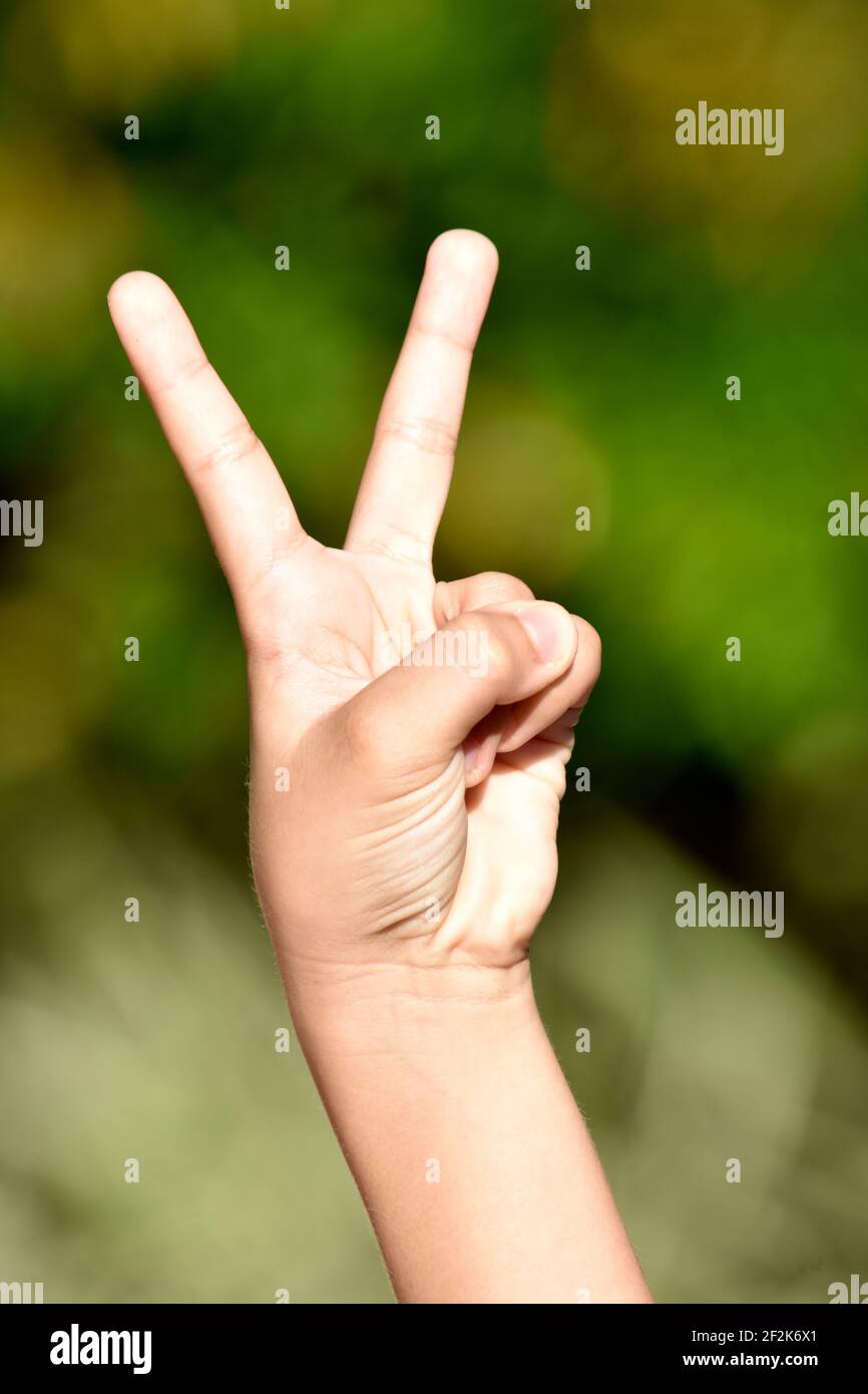 A Child Hand Gesture Number Two Stock Photo - Alamy