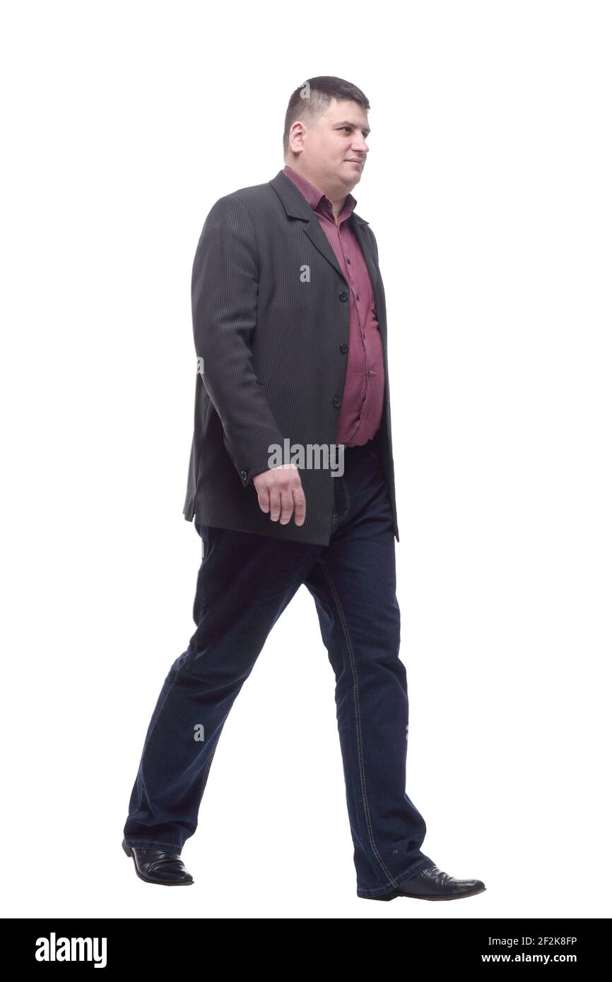 Mature man in business suit striding forward Stock Photo - Alamy