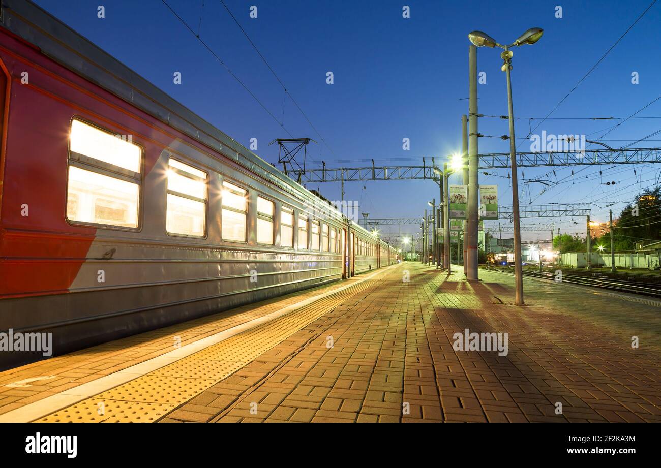 Train on Moscow passenger platform at night (Belorussky railway station ...