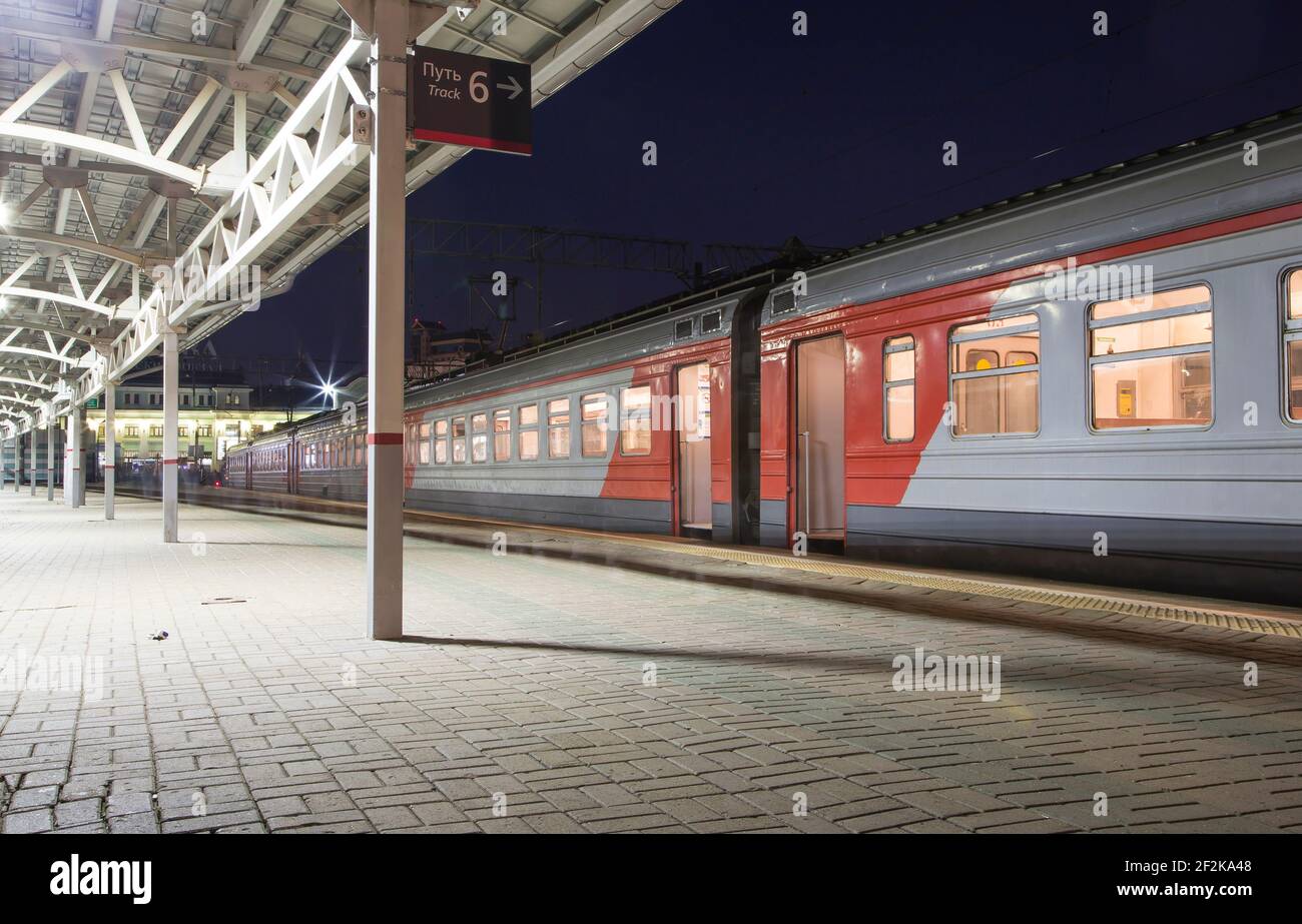 Train on Moscow passenger platform at night (Belorussky railway station ...