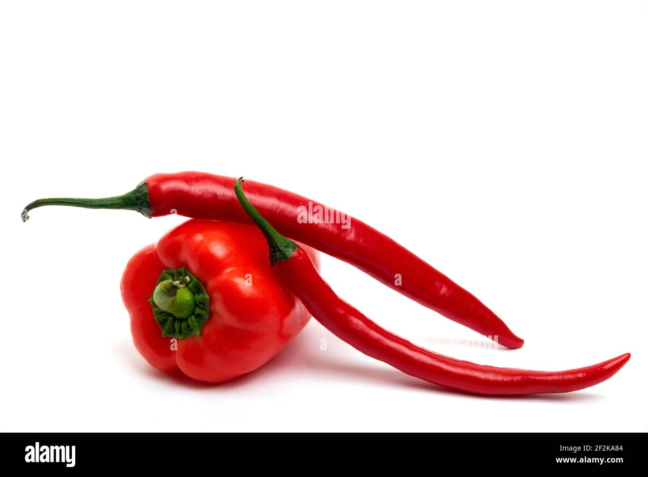 Red fresh chili and bell peppers isolated on white background Stock ...