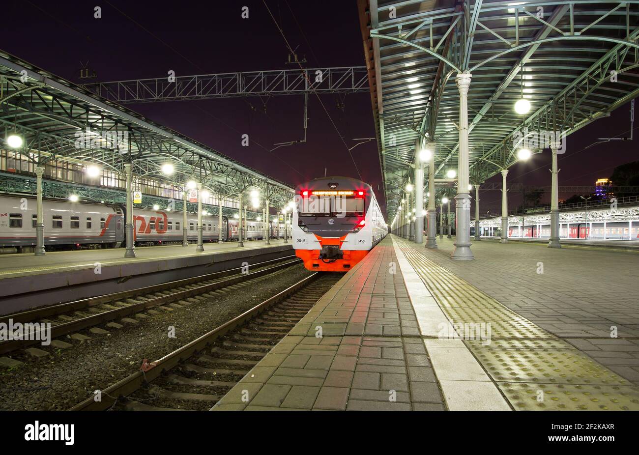 Train on Moscow passenger platform at night (Belorussky railway station ...