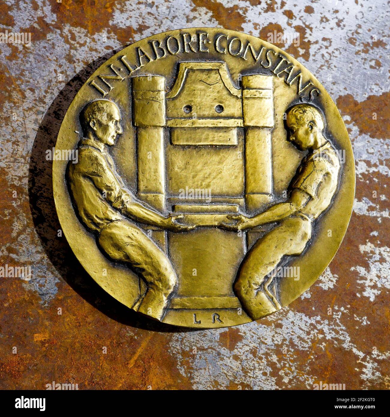 Bronze medal, with two workers and the words "Hard workers ...