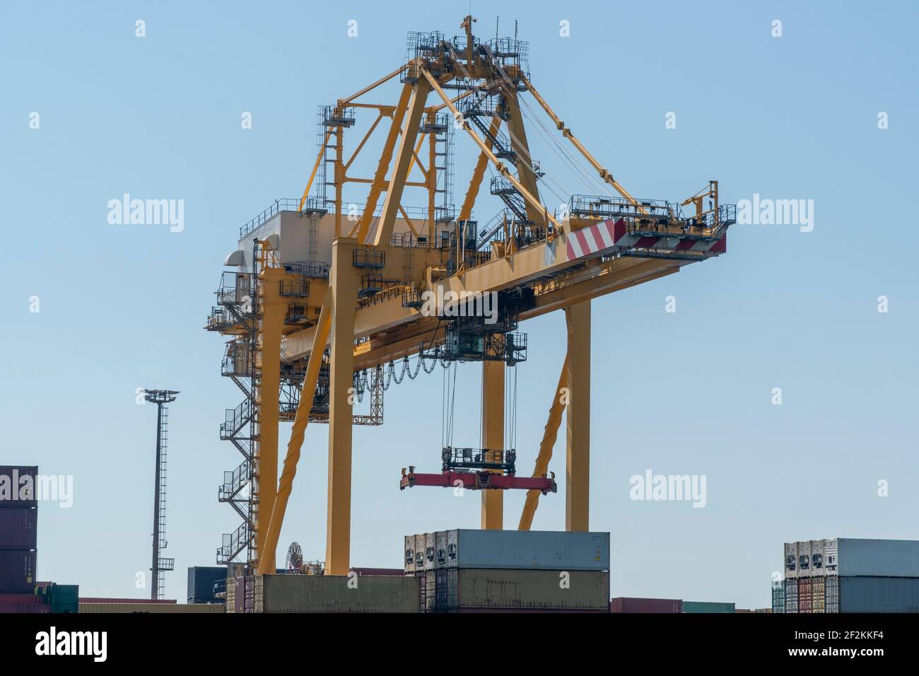Worldwide shipping and cargo concept: View on yellow crane lift ...