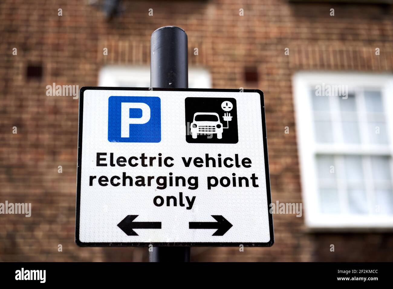 Electric vehicle signage at a Source London EV charging station in ...