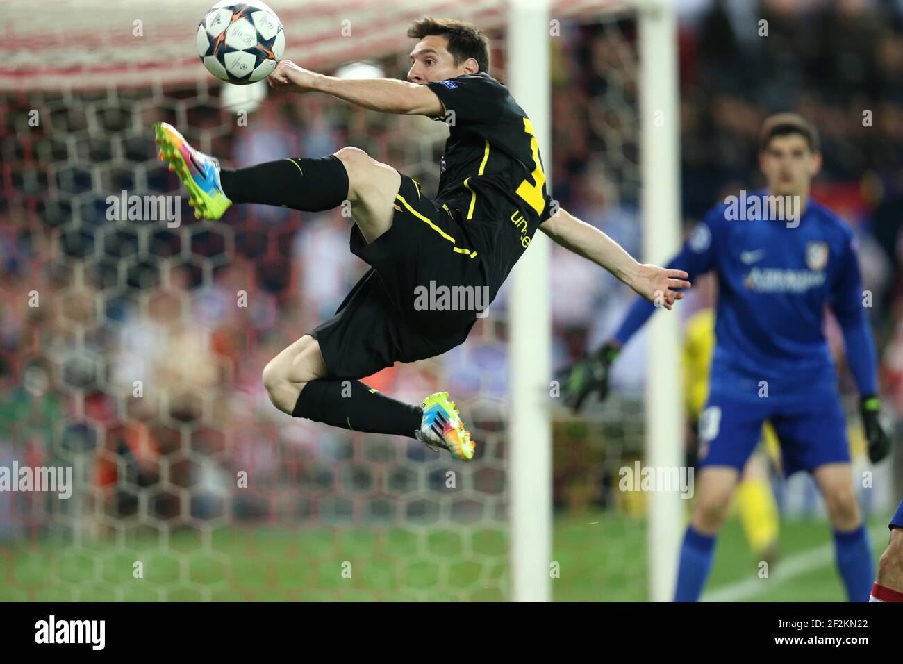 Lionel Messi of FC Barcelona jumps to control the ball during the UEFA ...