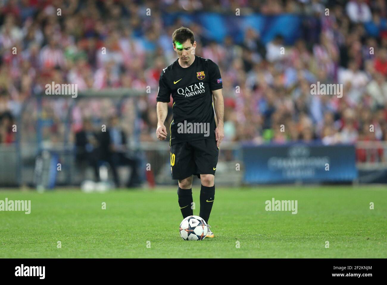 Lionel Messi of FC Barcelona is targeted with a laser beam in his face ...
