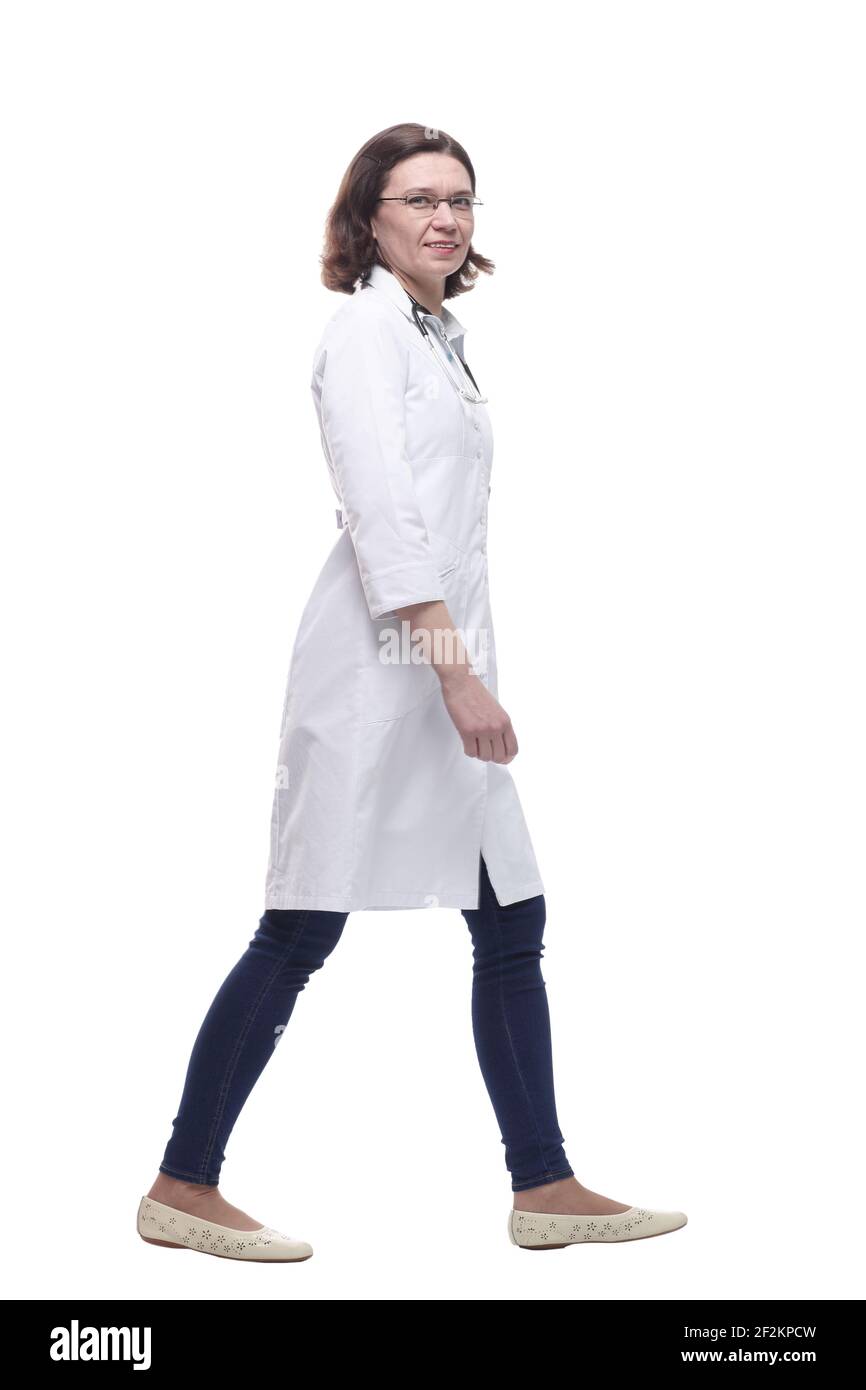 Mature female doctor with a stethoscope goes forward Stock Photo - Alamy