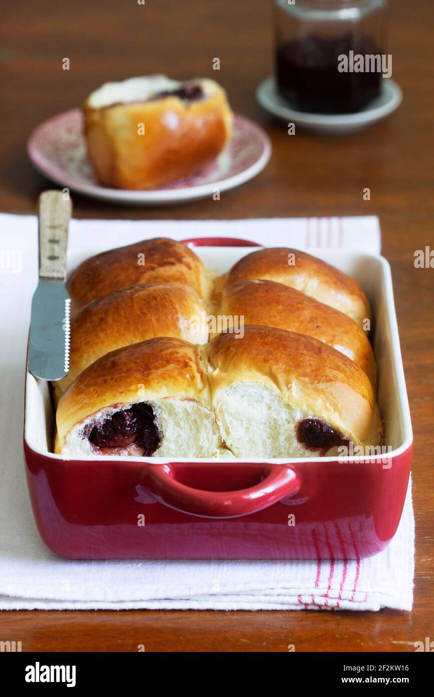 Austrian buns with cherry filling in a baking dish. Rustic style Stock ...