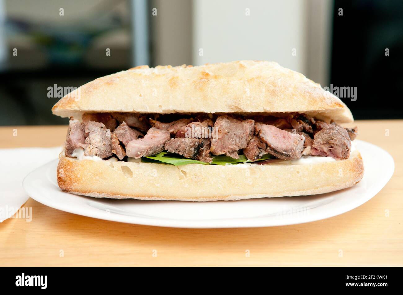 A tasty beef sandwich with a ciabatta bun Stock Photo - Alamy