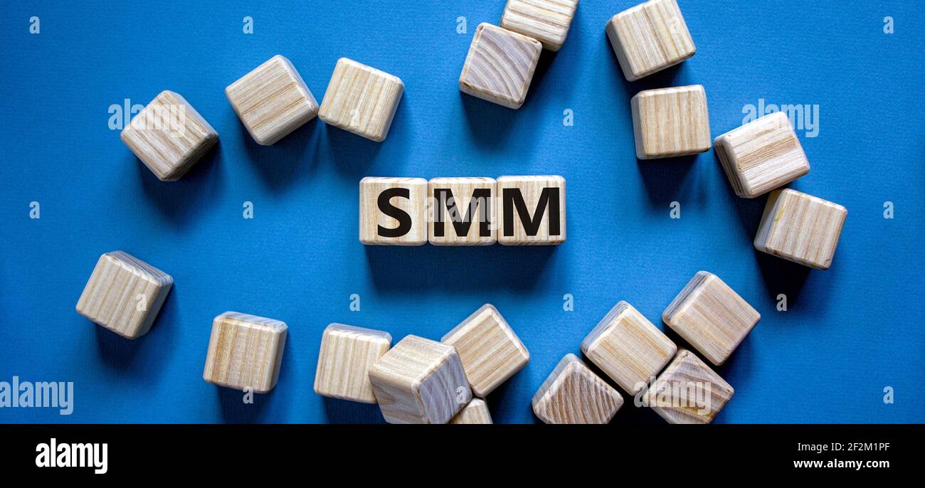 SMM, social media marketing symbol. Wooden cubes with word 'SMM ...