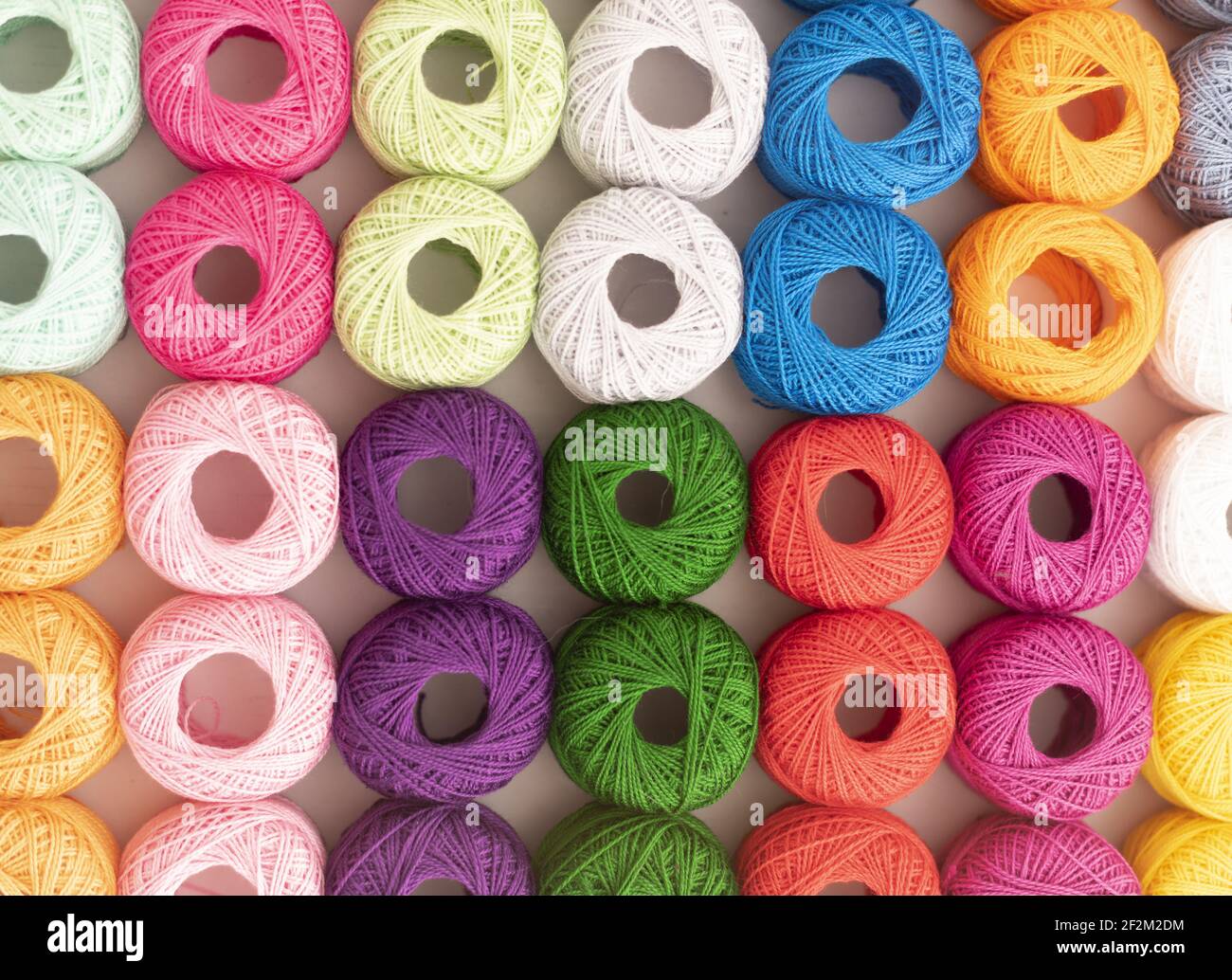 A top view of colorful yarns in a cardboard box under the lights Stock ...