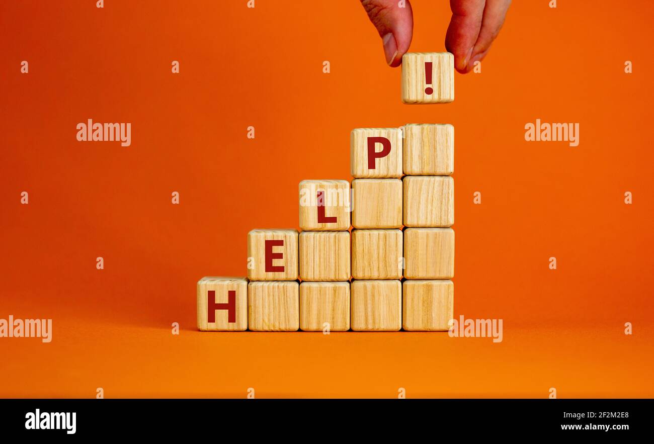 Support and help symbol. Pyramid from wooden cubes with the word 'help ...