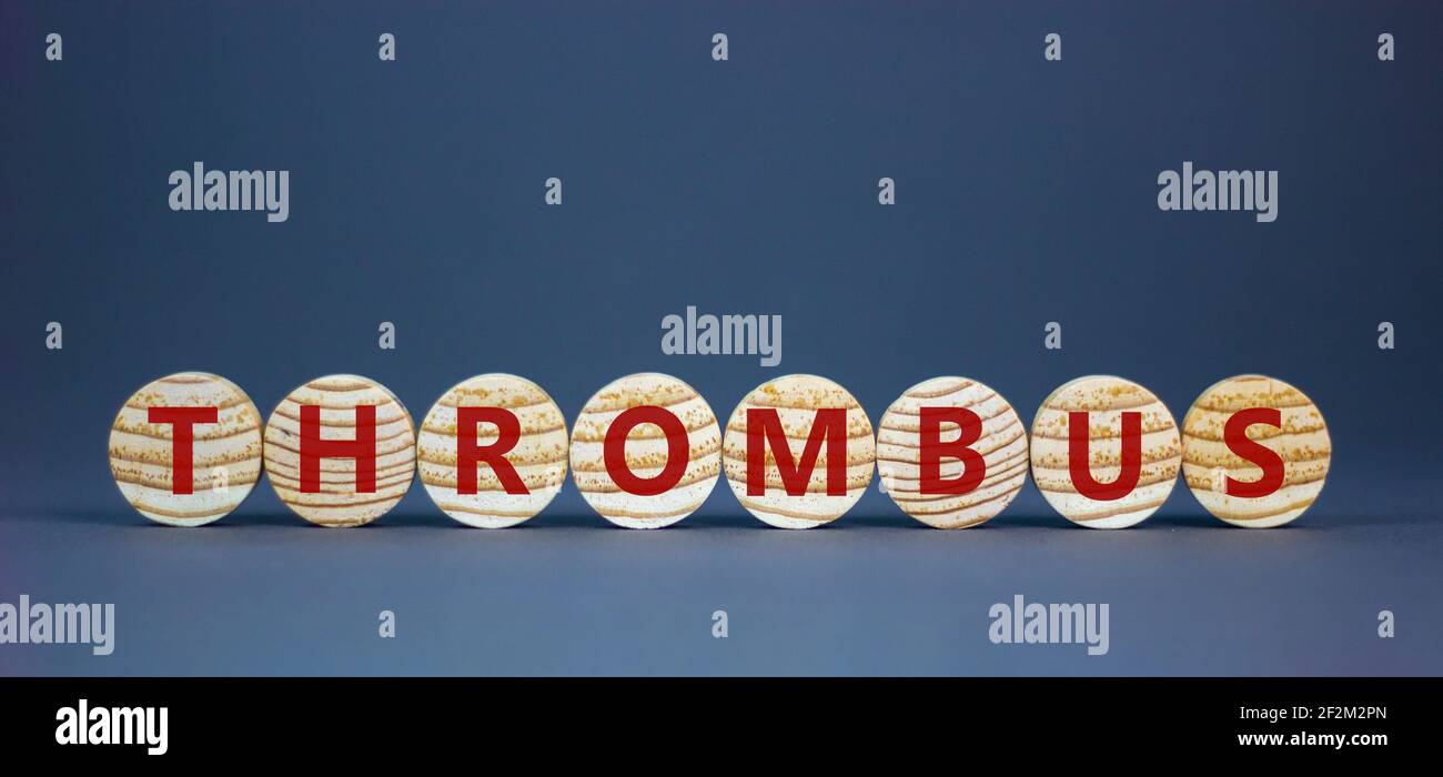 Medical and and thrombus symbol. Wooden circles with the word 'thrombus ...