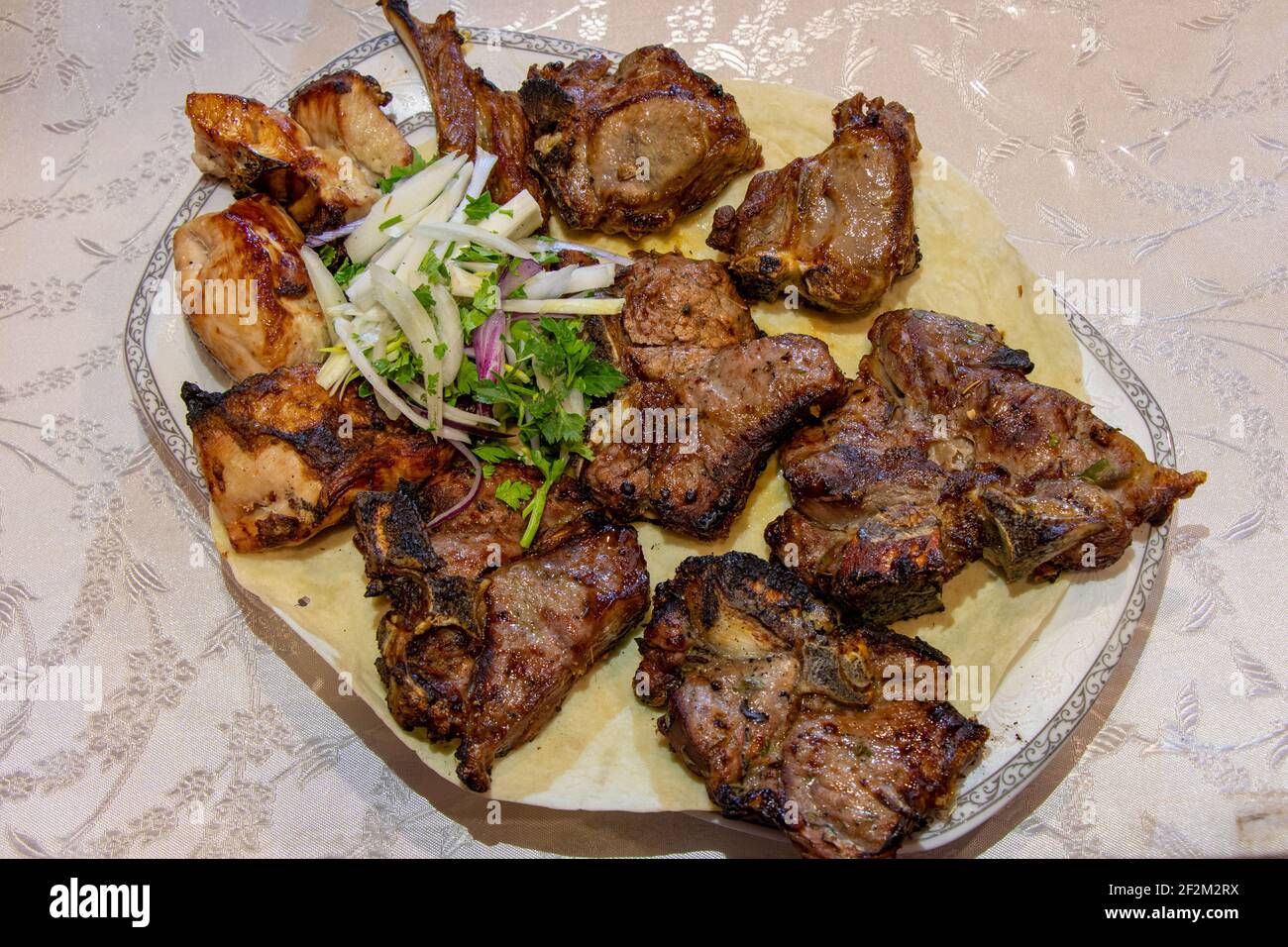 Kebab on the plate. Grilled meat. Traditional Azerbaijani kebab ...