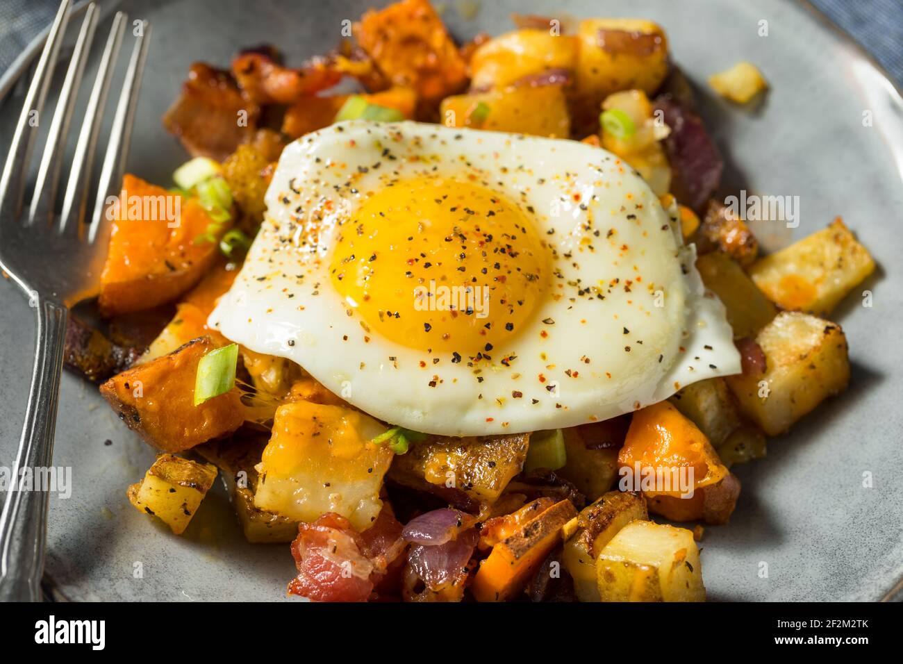 Homemade Healthy Sweet Potato Hash with Fried Eggs Stock Photo - Alamy