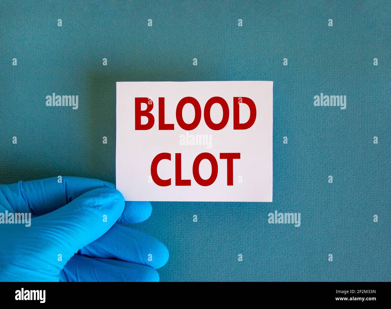 Medical and blood clot symbol. Doctor hand. White card with words ...