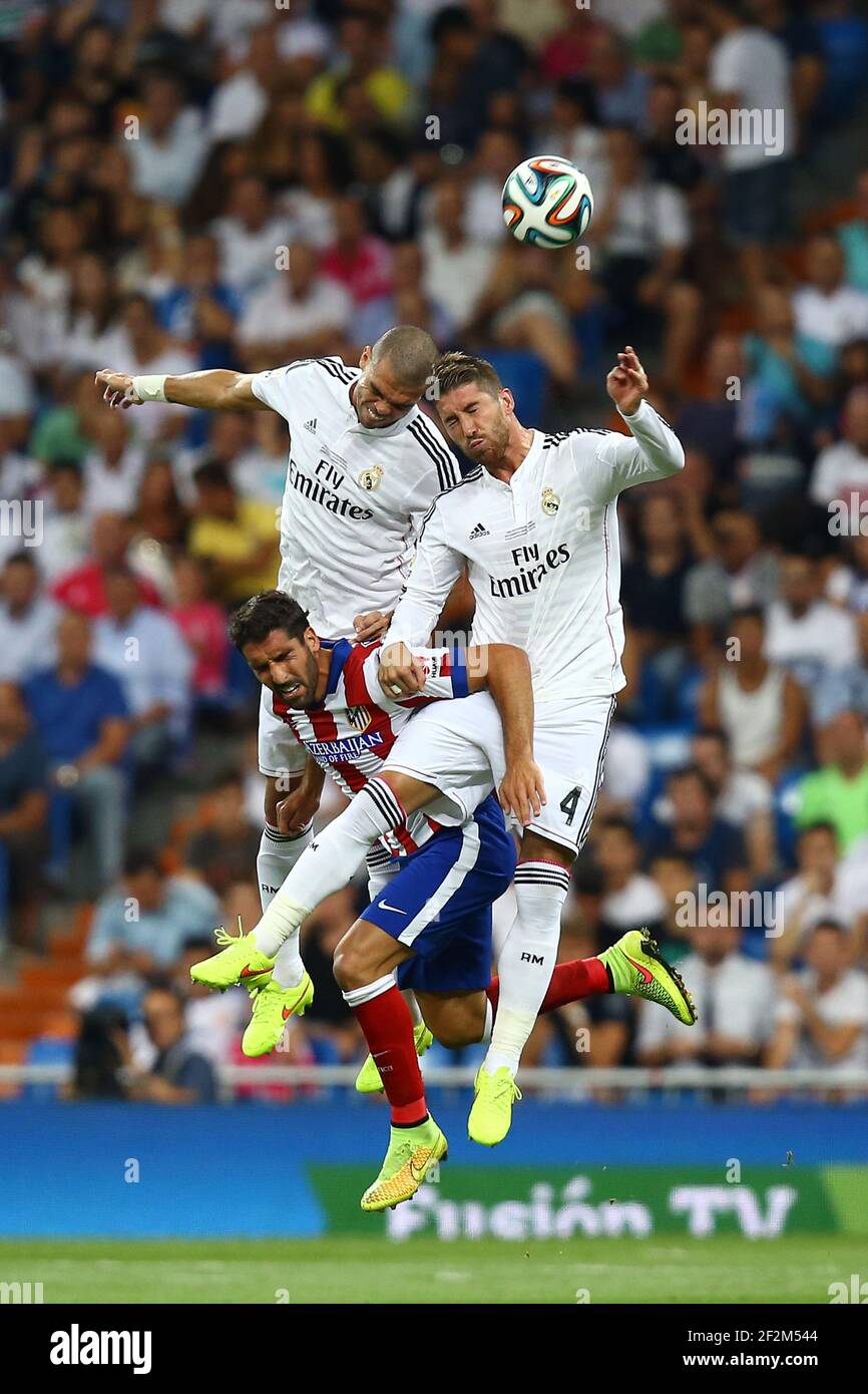 Sergio Ramos and Pepe of Real Madrid duels for the ball with Raul ...