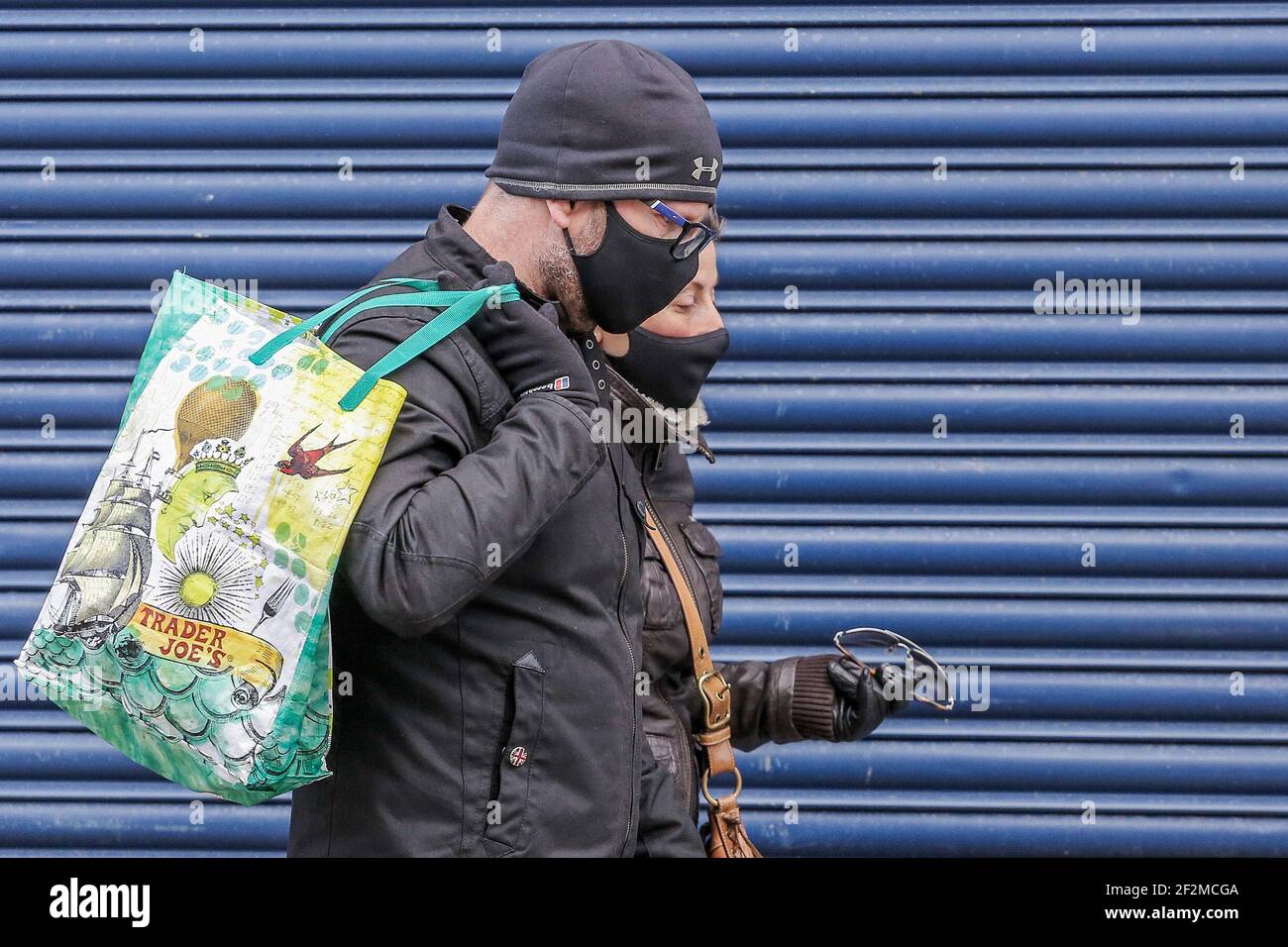 12th, March, 2021. Cheltenham, England. A member of the public walks ...