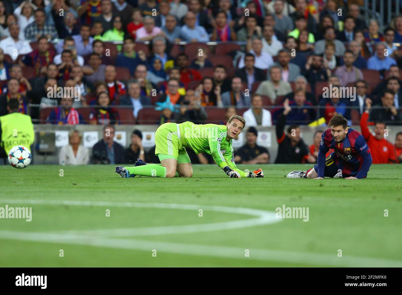 Manuel Neuer of FC Bayern Munich and Lionel Messi of FC Barcelona look ...