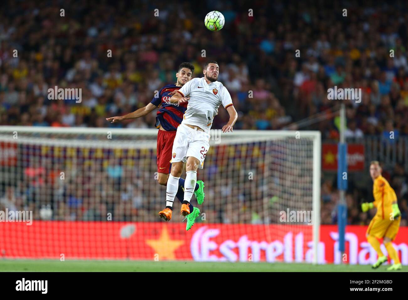Marc Bartra of FC Barcelona duels for the ball with Mattia Destro of AS ...