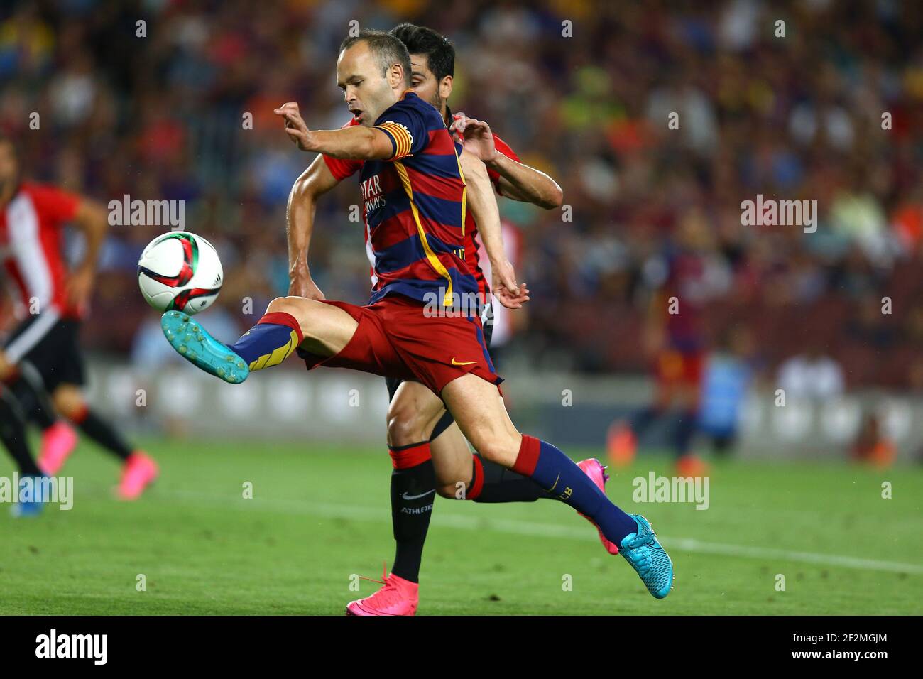 Andres Iniesta FC Barcelona duels for the ball with Eneko Boveda of ...