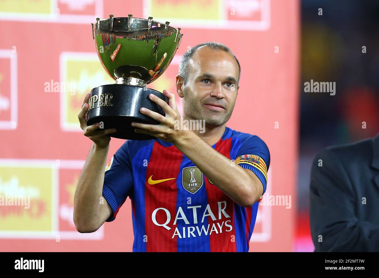Andres Iniesta of FC Barcelona holds the Joan Gampar Trophy during the ...