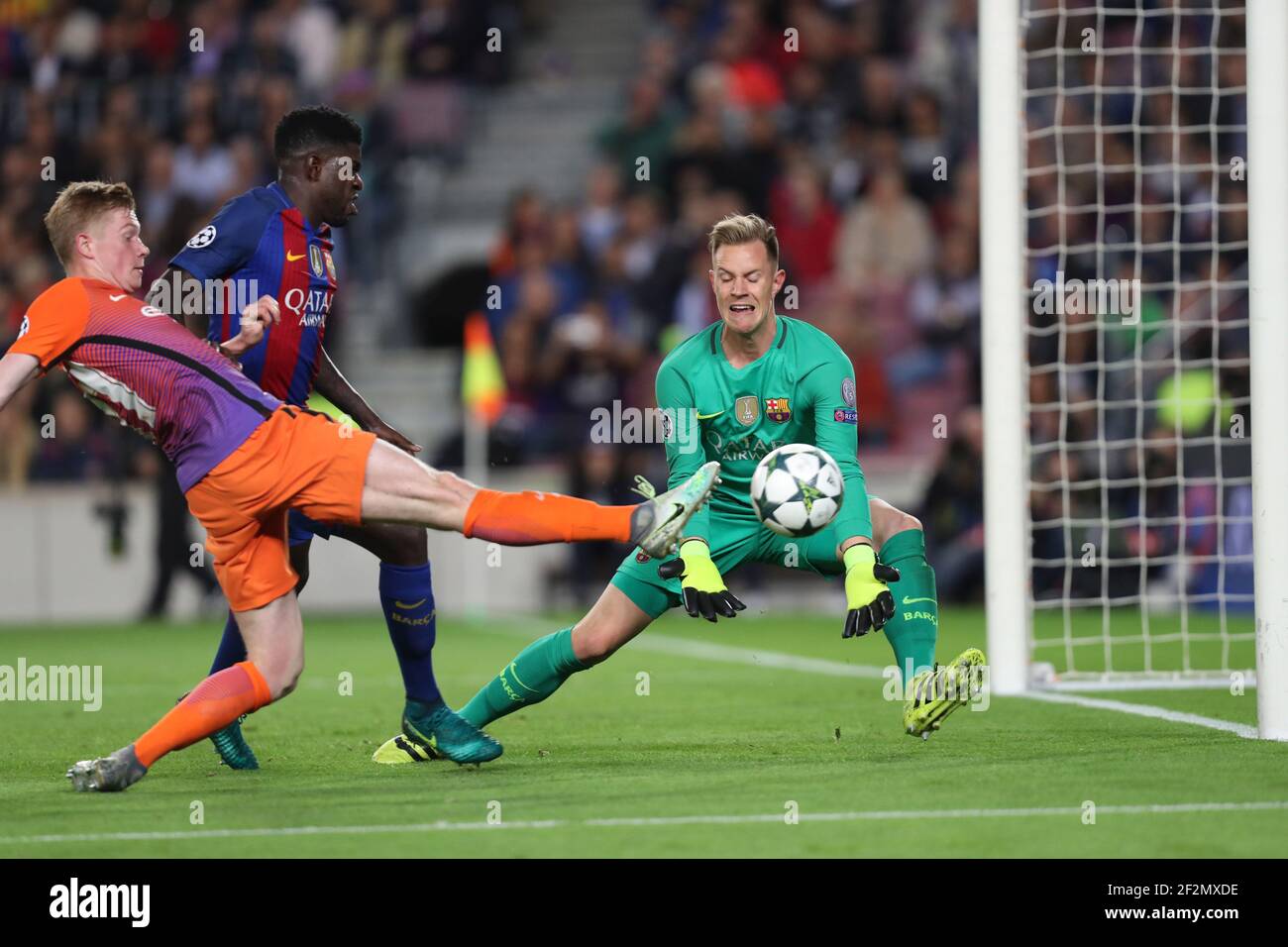 Marc Andre Ter Stegen of FC Barcelona makes a save under pressure from ...