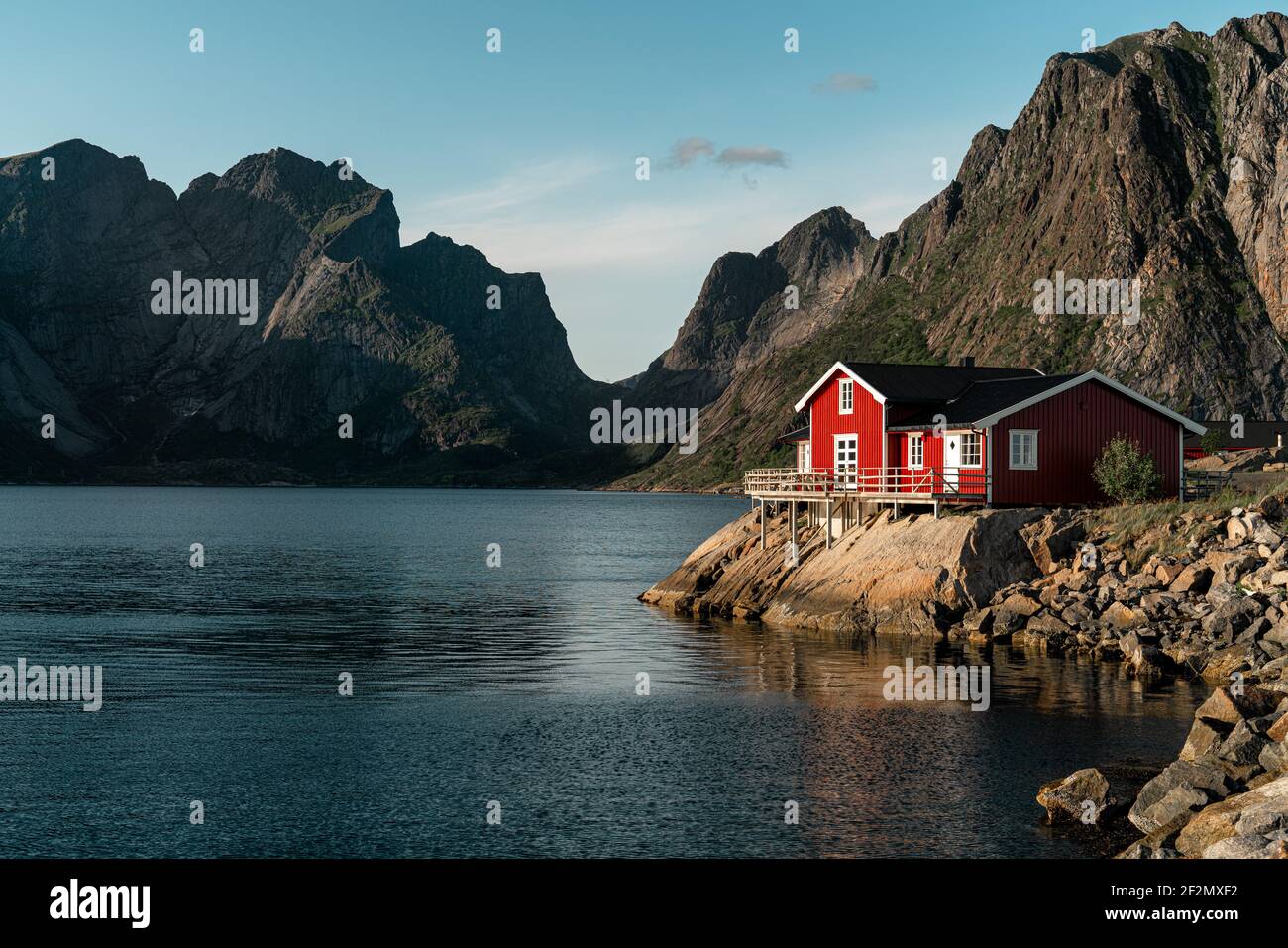 A single classic red cabin on the Islands of Lofoten. Perfect light ...
