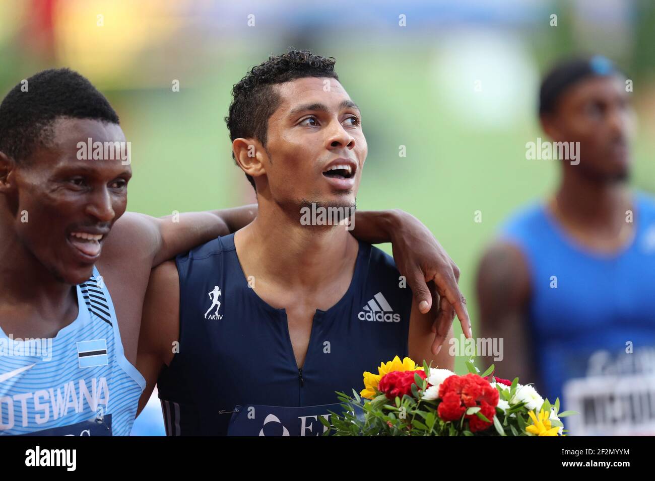 Wayde Van Niekerk of South Africa celebrates victory with Isaac Makwala ...
