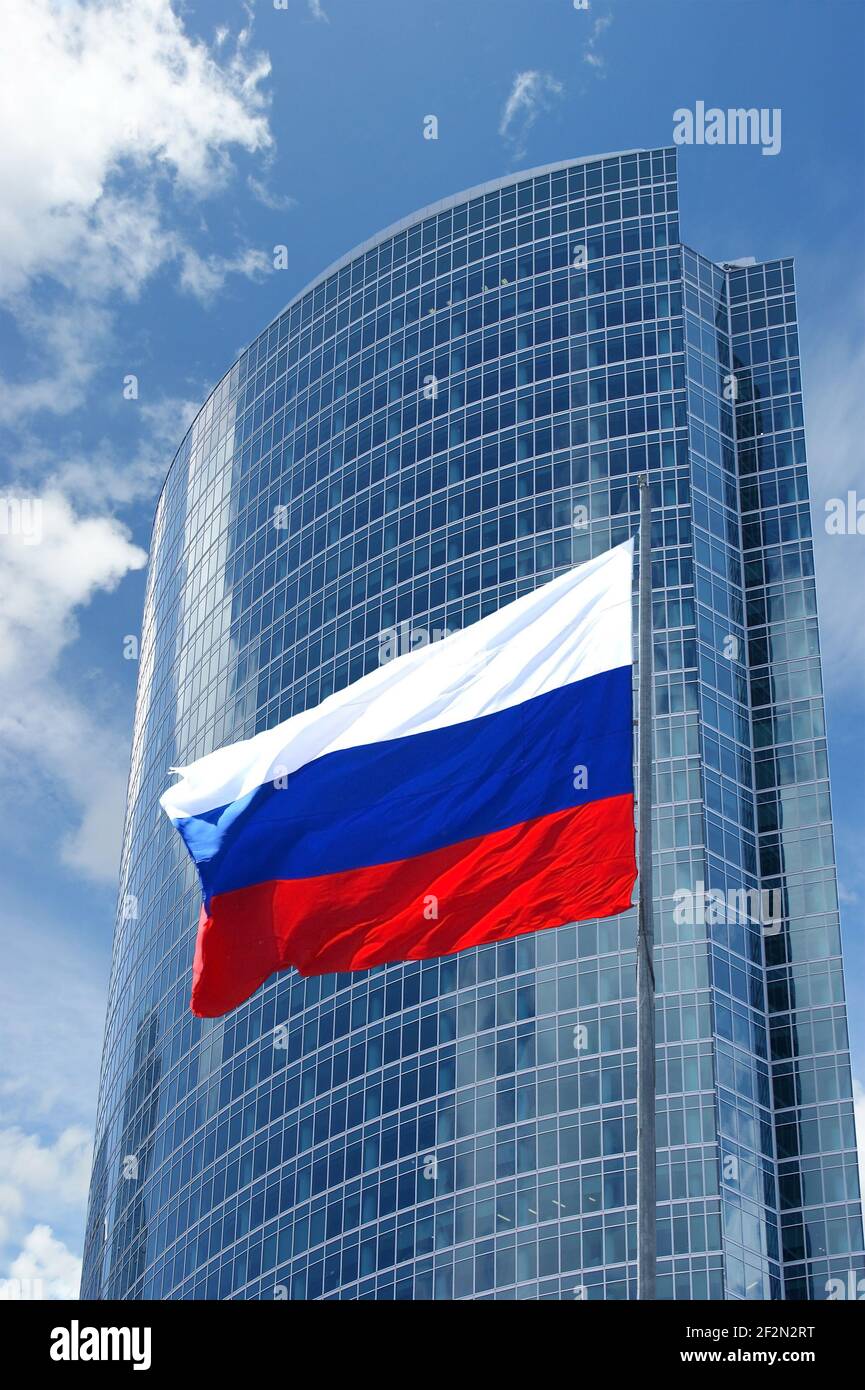 Russian flag on the background of the windows of office building Stock ...