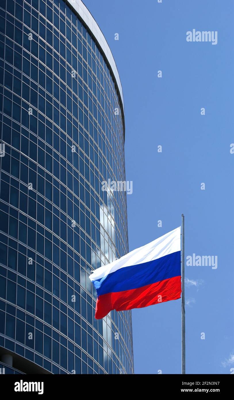 Russian flag on the background of the windows of office building Stock ...