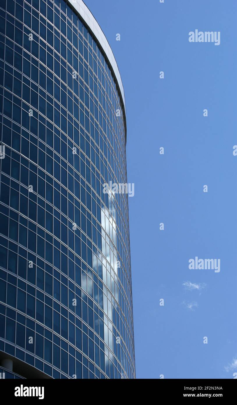 Reflection of a cloudy sky in glass wall of an office building Stock ...