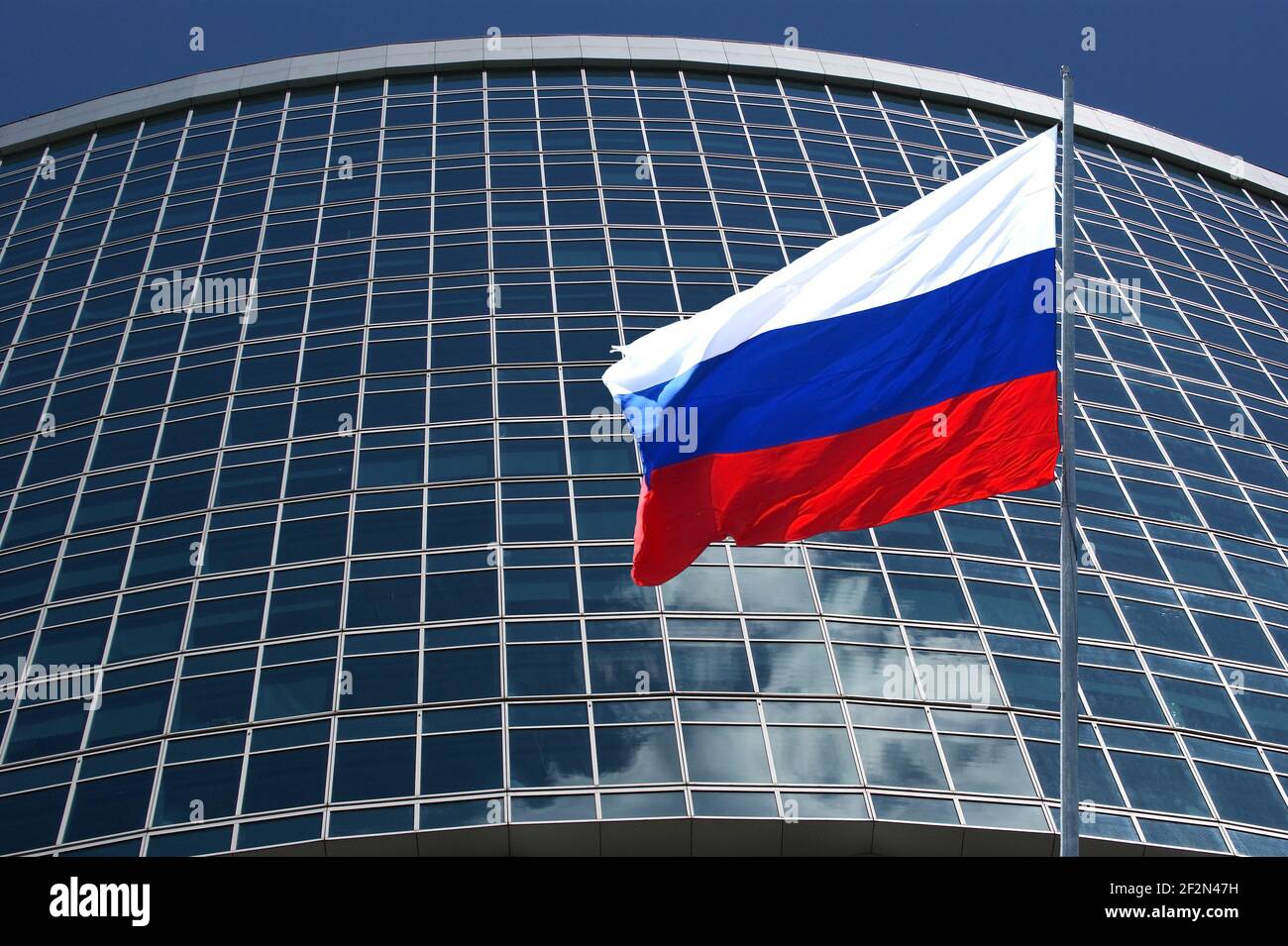 Russian flag on the background of the windows of office building Stock ...