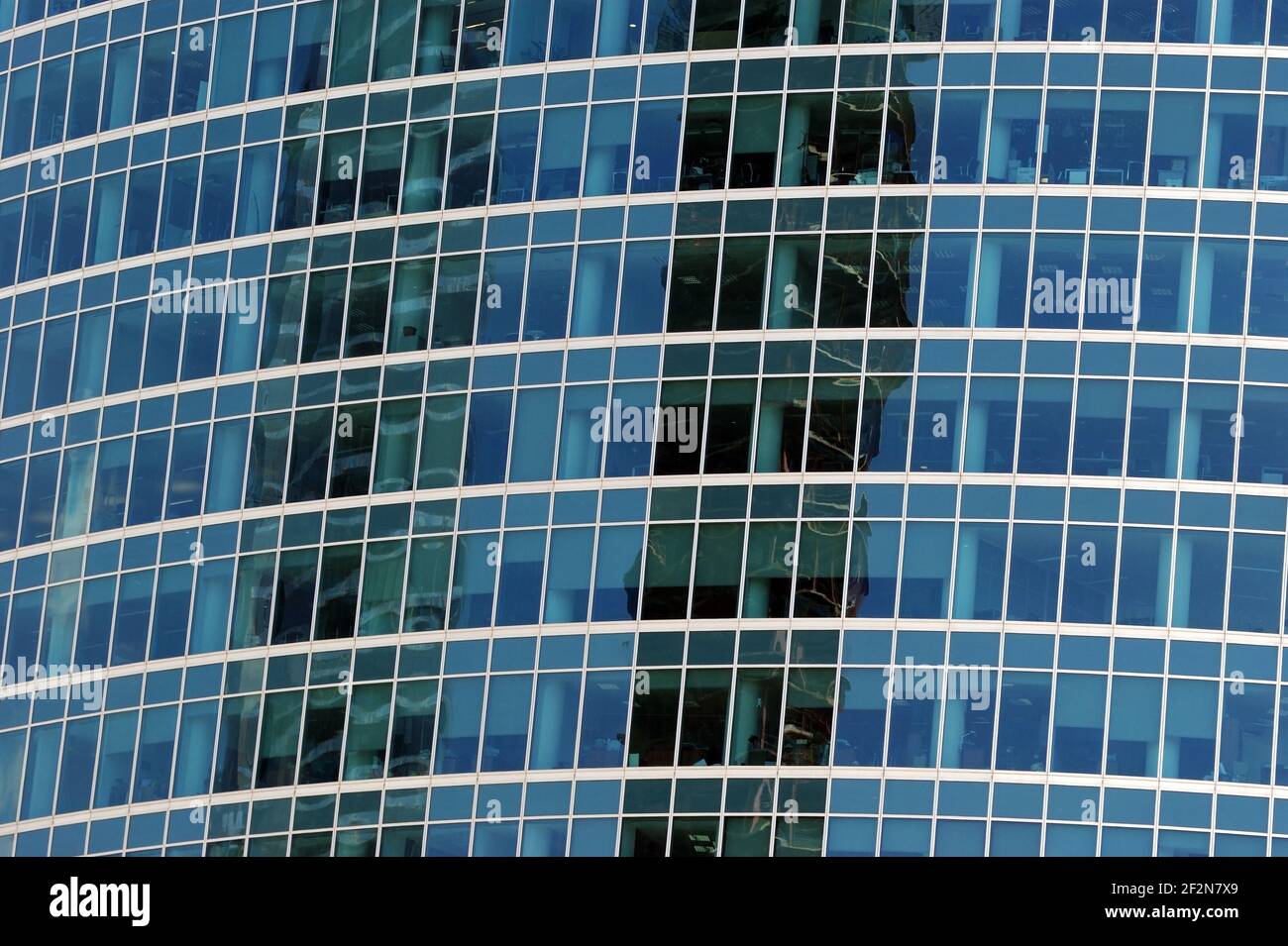Reflection of a cloudy sky in glass wall of an office building Stock ...