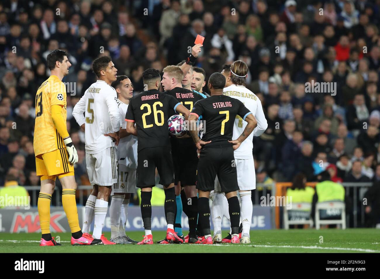 referee Daniele Orsato shows a red card to Sergio Ramos of Real Madrid ...