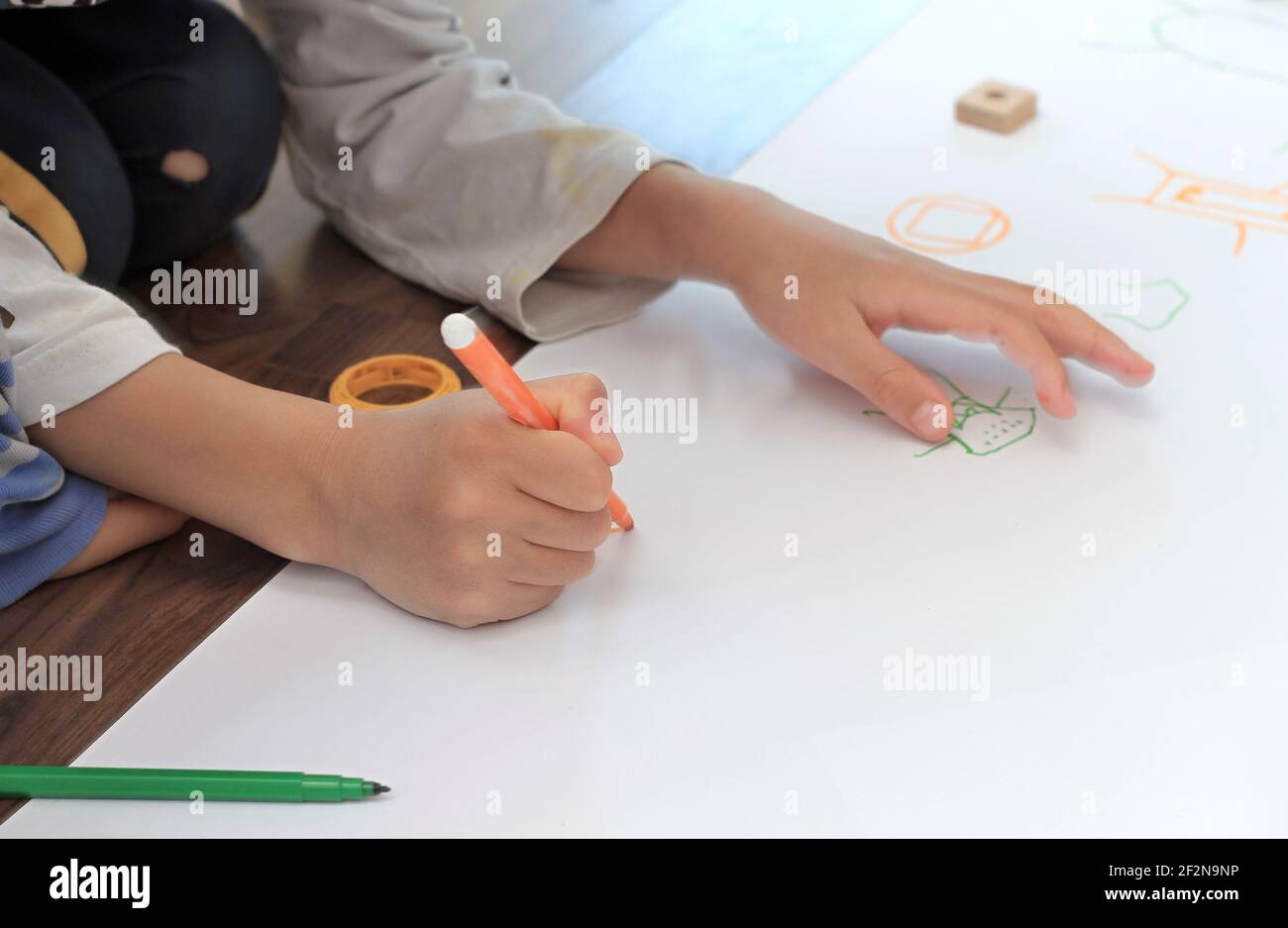 school child writing with pen on notepad stock photo Stock Photo - Alamy