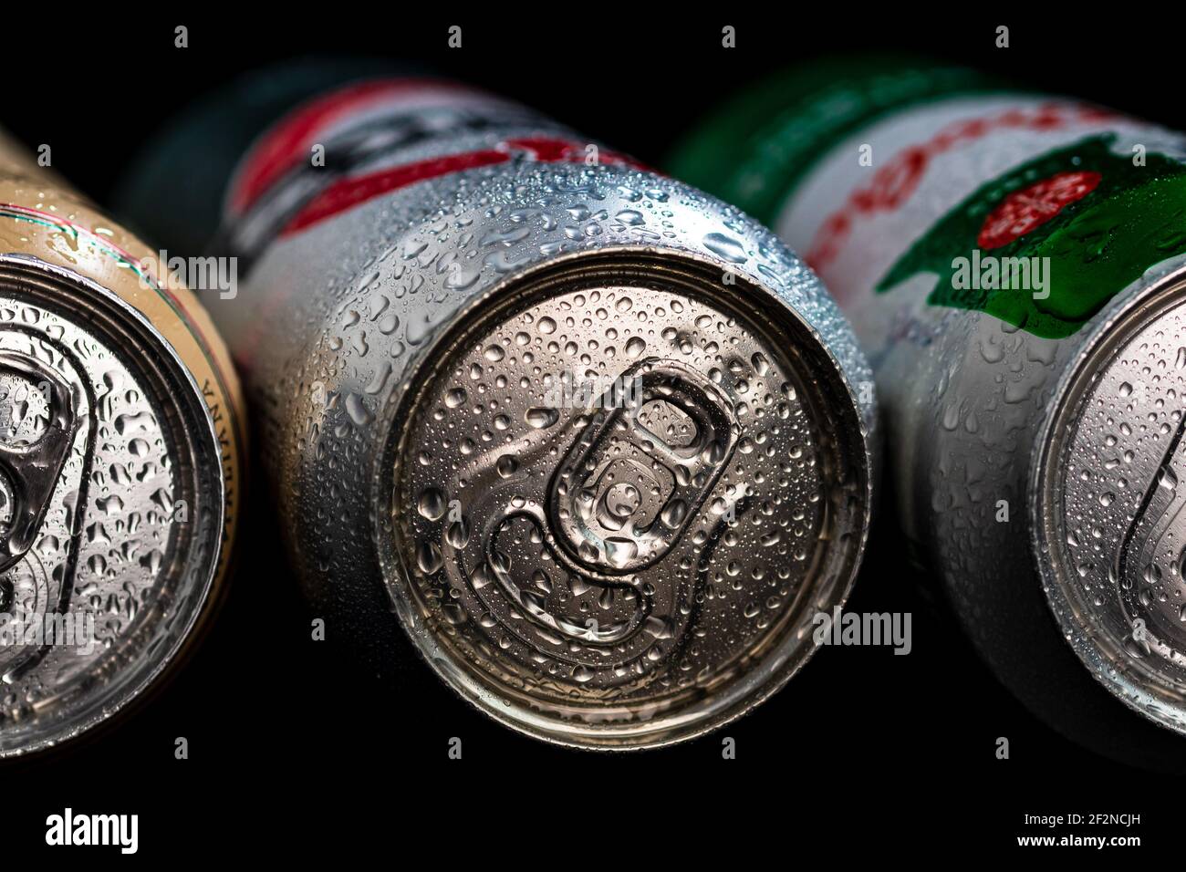 Condensation water droplets on beer cans isolated on black. Bucharest ...