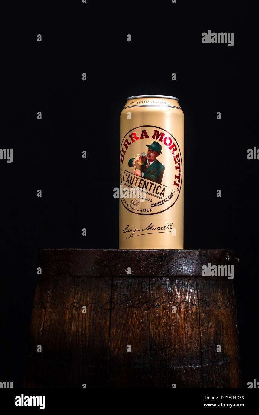 Can of Birra Moretti beer on wooden barrel with dark background ...