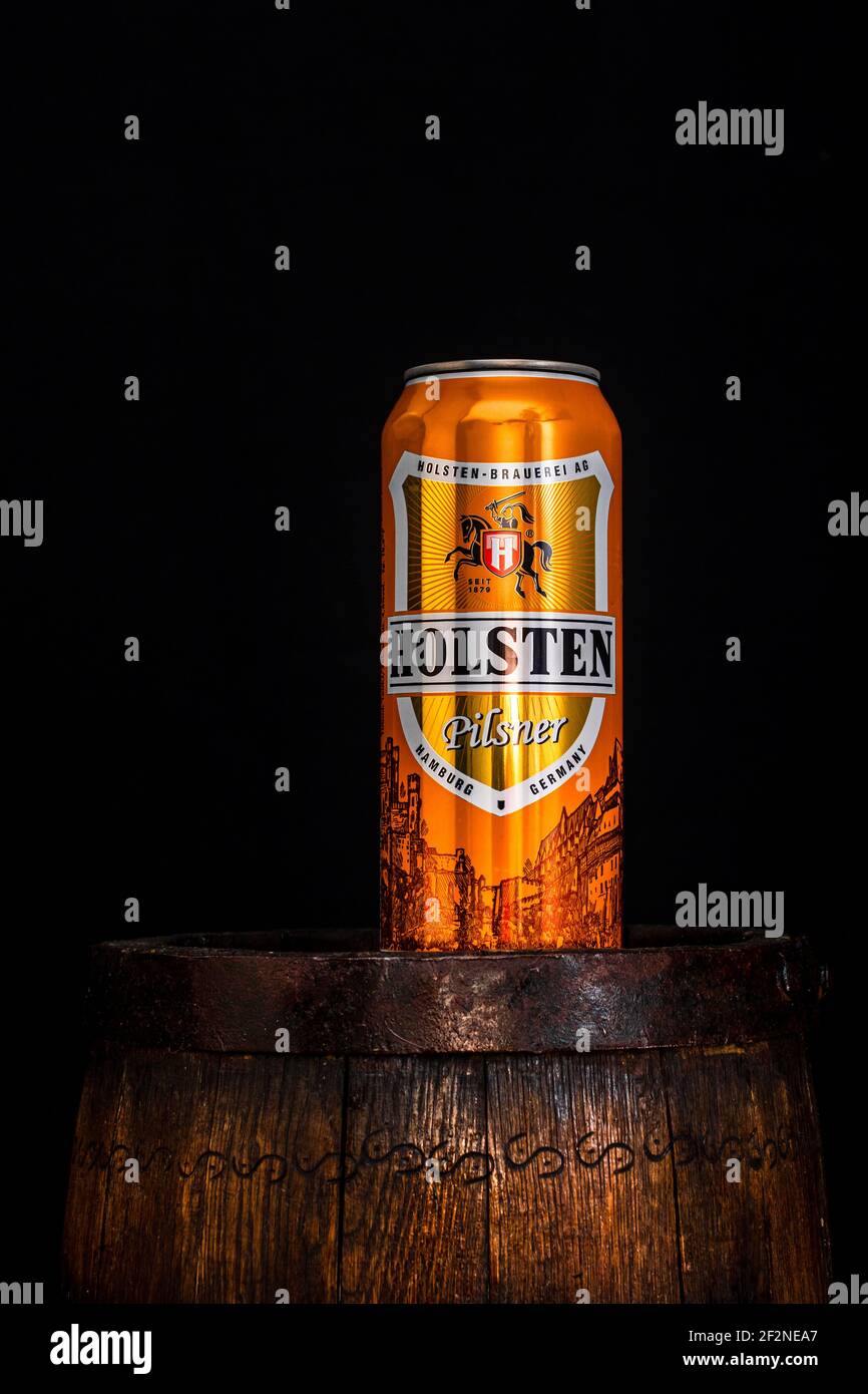 Can of Holsten beer on beer barrel with dark background. Illustrative ...