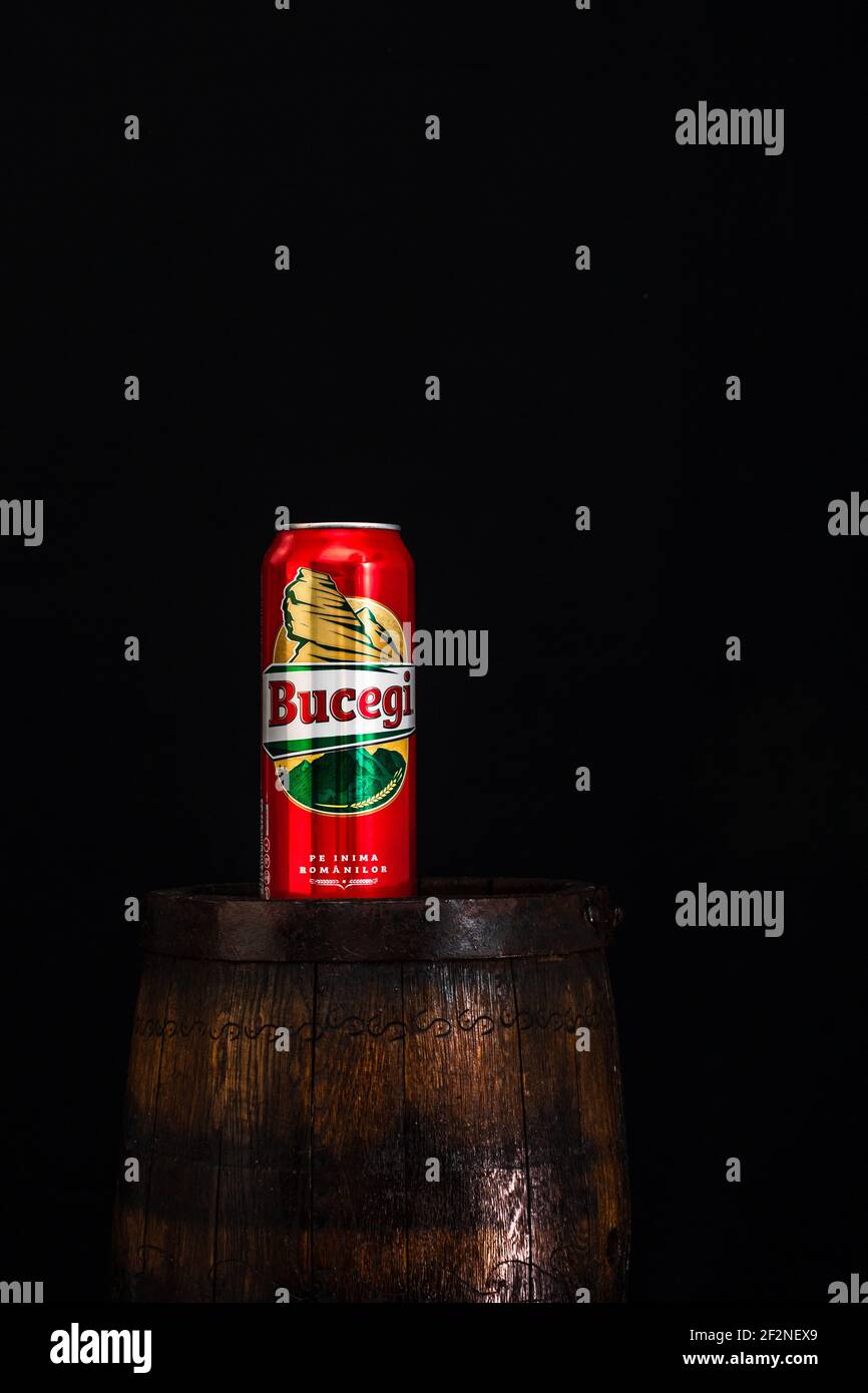 Can of Bucegi beer on beer barrel with dark background. Illustrative ...