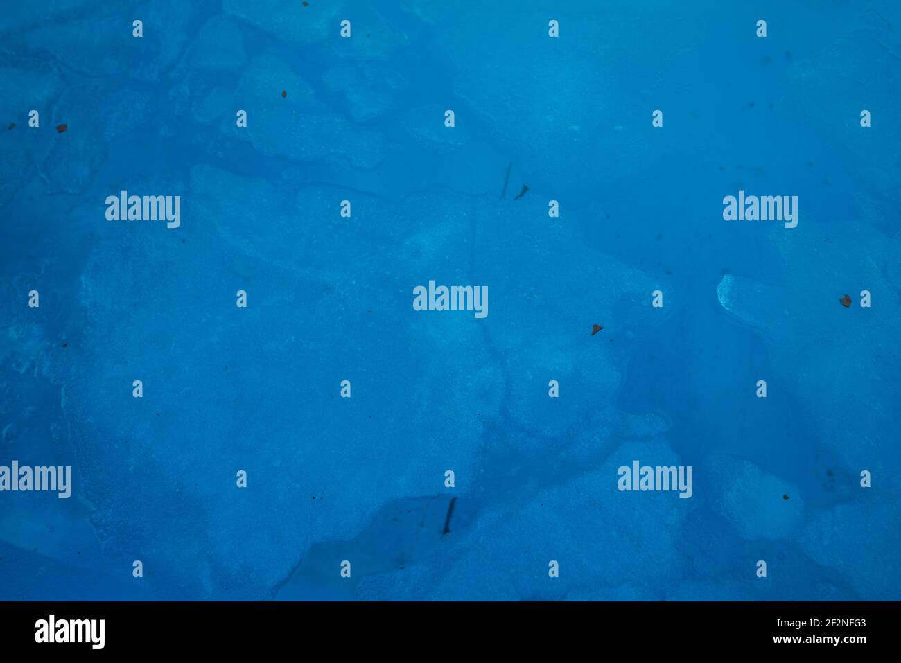 Ice texture on the pool in the winter Stock Photo - Alamy