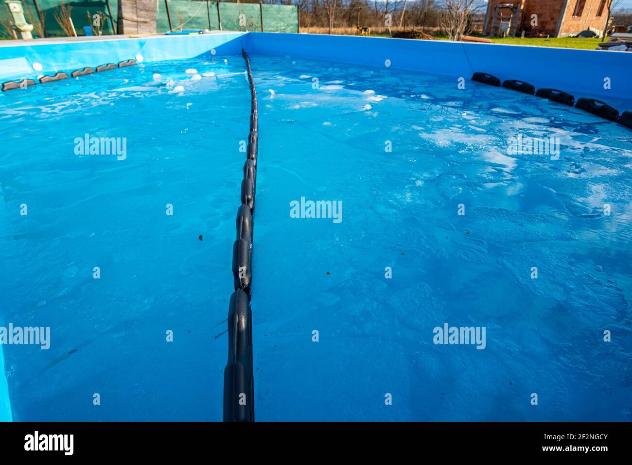 Ice texture on the pool in the winter Stock Photo - Alamy