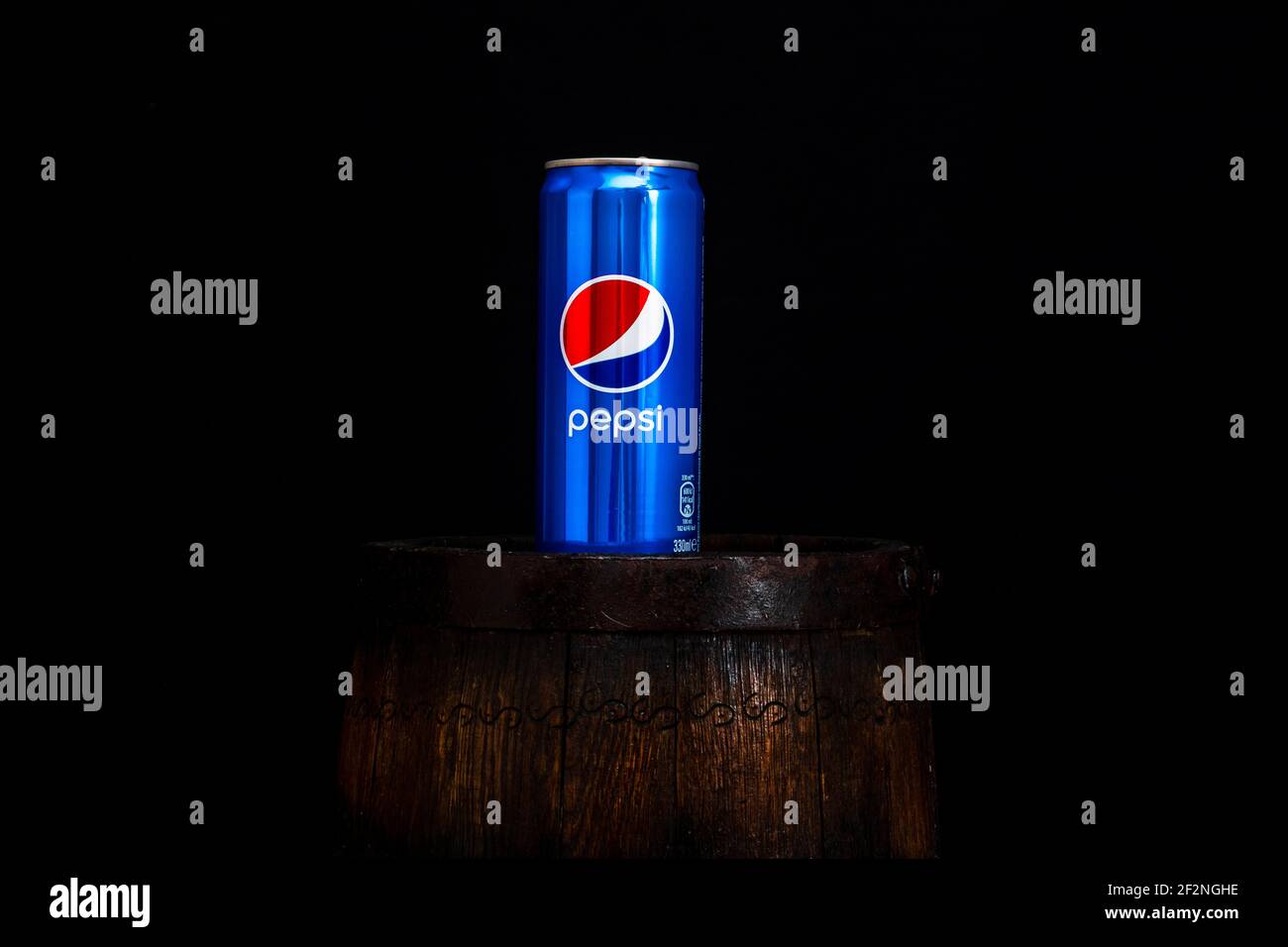 Can of Pepsi Cola on wooden barrel with dark background. Illustrative ...